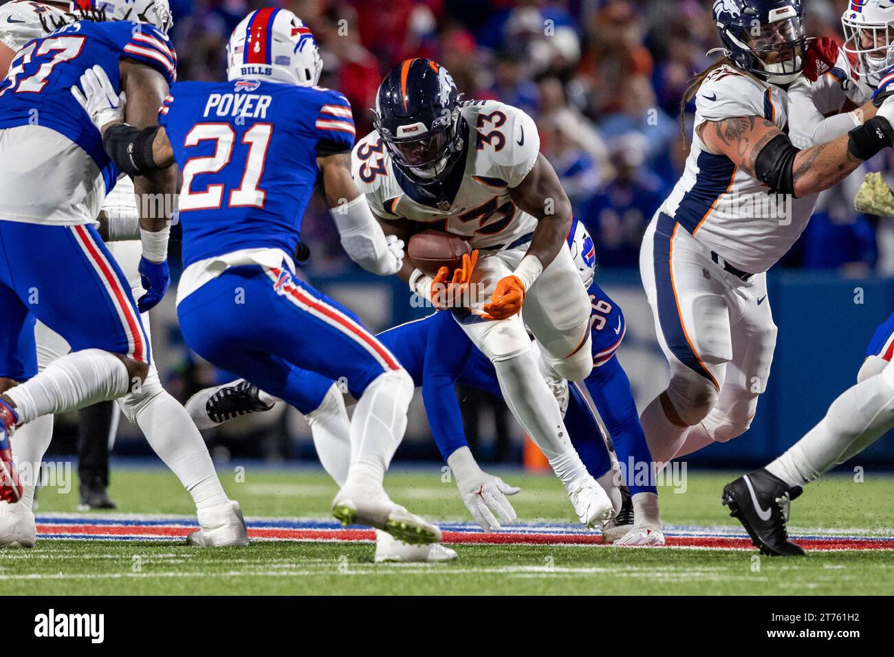 Denver Broncos running back Javonte Williams (33) rushes during an NFL ...