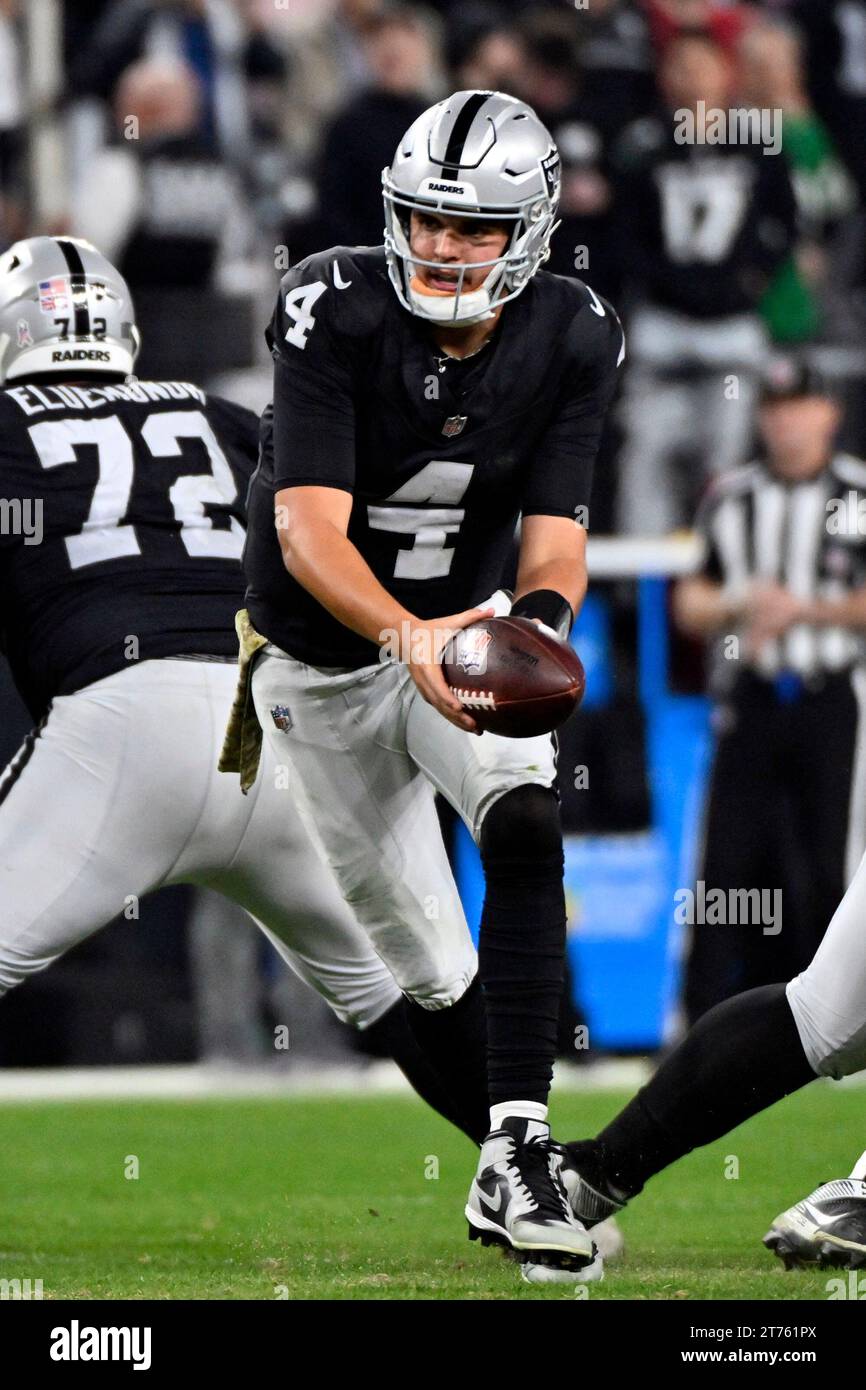 Las Vegas Raiders quarterback Aidan O'Connell (4) looks to hand off the ...