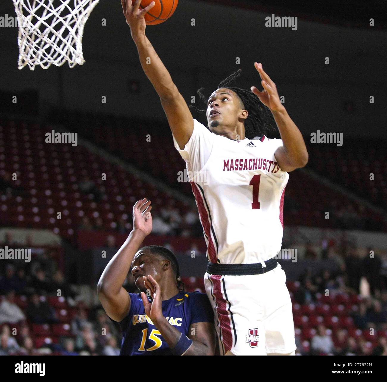 Massachusetts' Daniel Hankins-Sanford (1) takes the ball up to the ...
