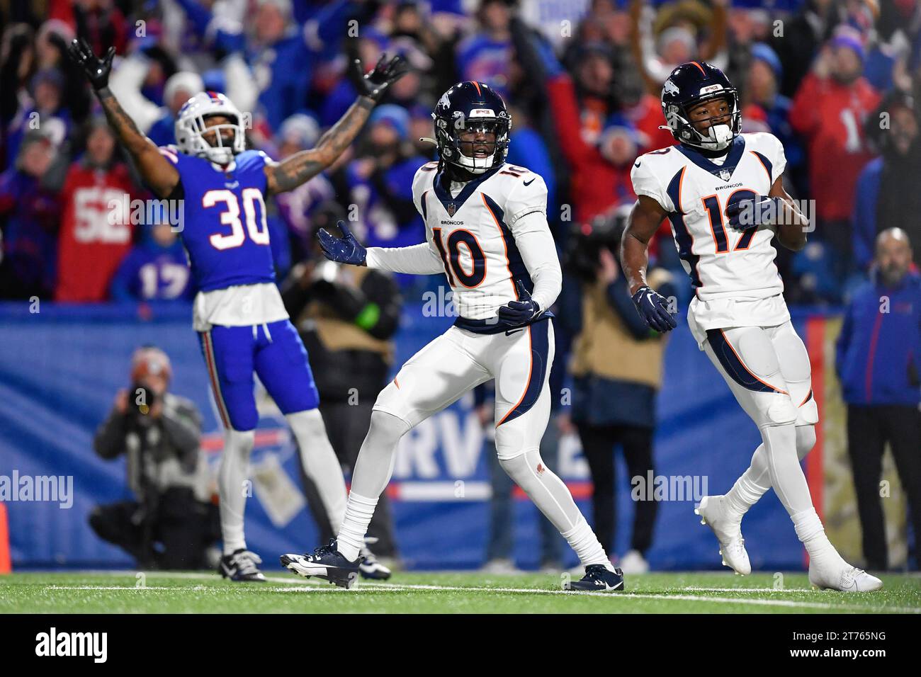 Denver Broncos' Jerry Jeudy, center, looks to the referee for a pass interference call during ...