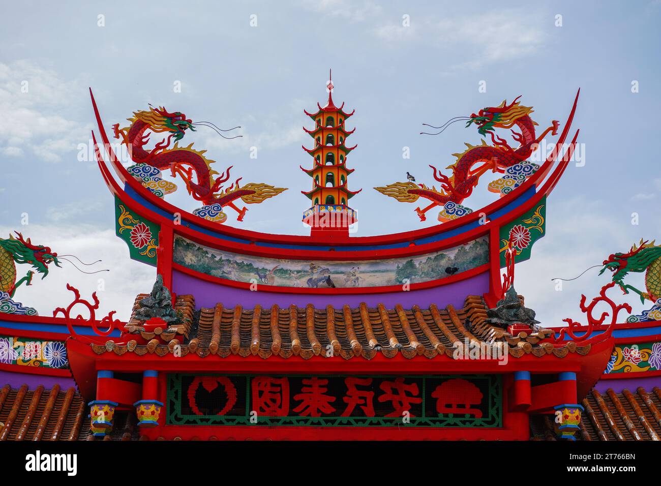 Chinese temple roof with dragons and pagoda. Ling San temple in Tuaran ...