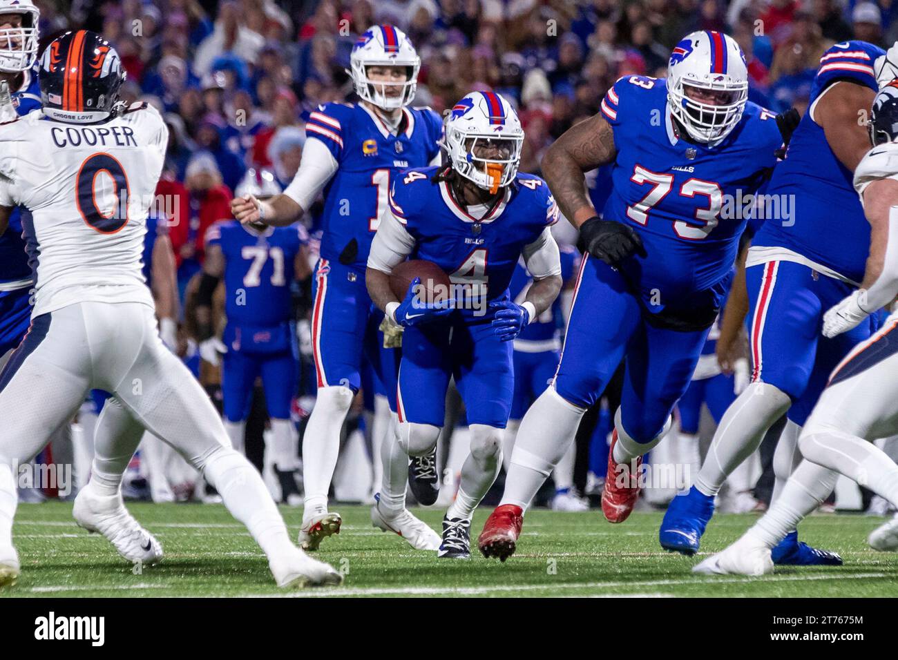 Buffalo Bills running back James Cook (4) rushes during an NFL football ...