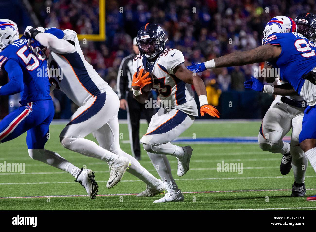 Denver Broncos running back Javonte Williams (33) rushes during an NFL ...