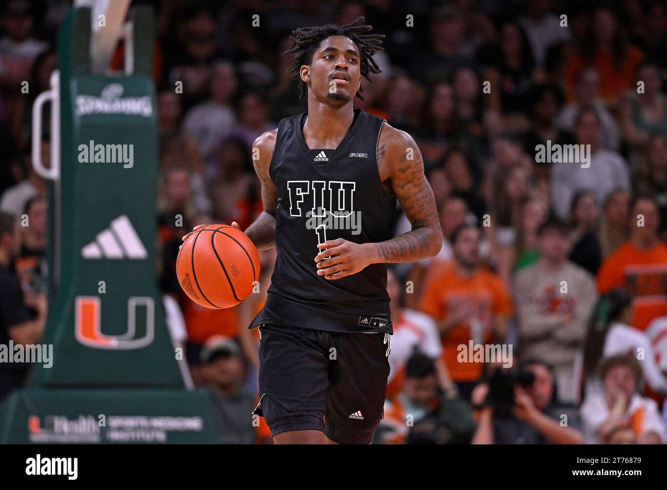CORAL GABLES, FL - NOVEMBER 13: FIU guard Dashon Gittens (1) handles ...