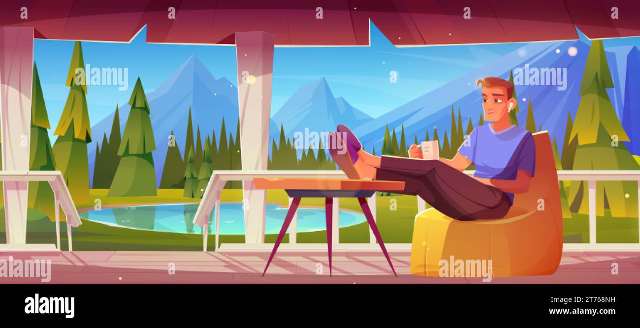 Man sits relaxing and drinking tea on terrace near mountain landscape ...