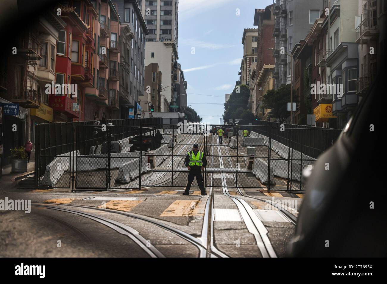 A man guards barricades at Powell and Washington Streets as part of ...