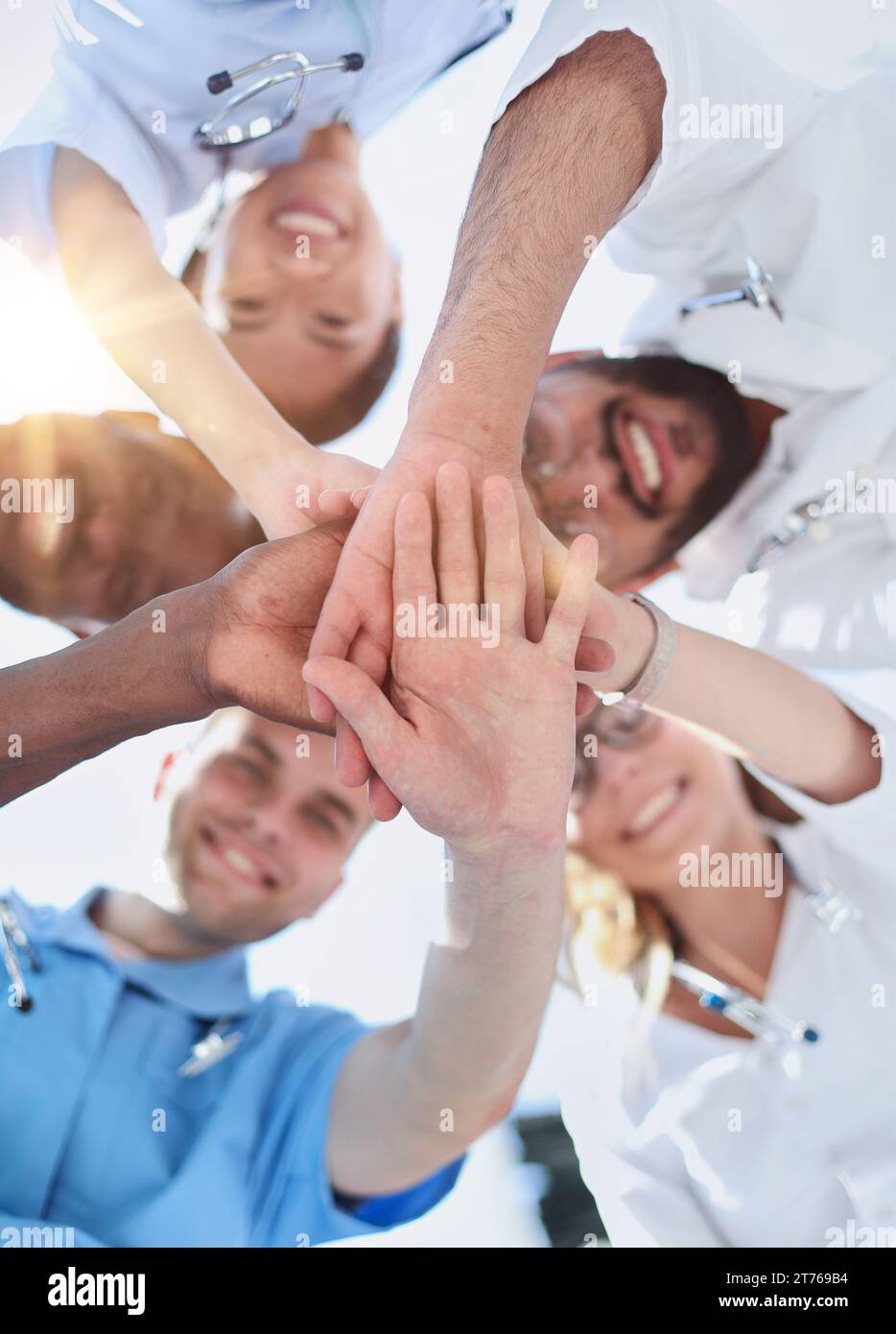 Professional Doctors Holding Each Other Hands. Multinational Medician ...