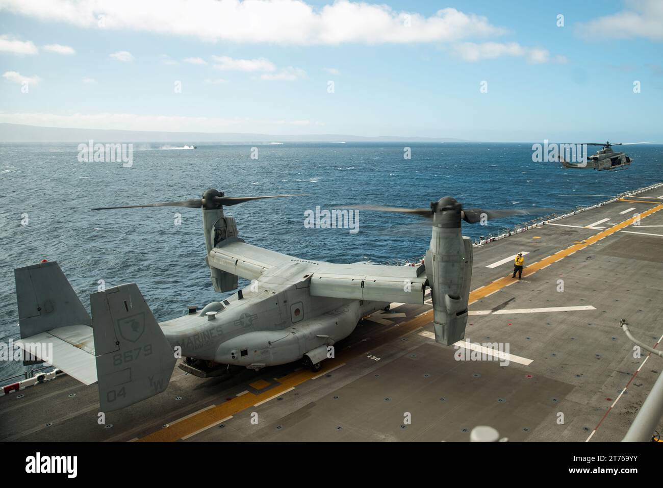 A U.S. Marine Corps MV-22B Osprey and UH-1Y Venom attached to Marine ...