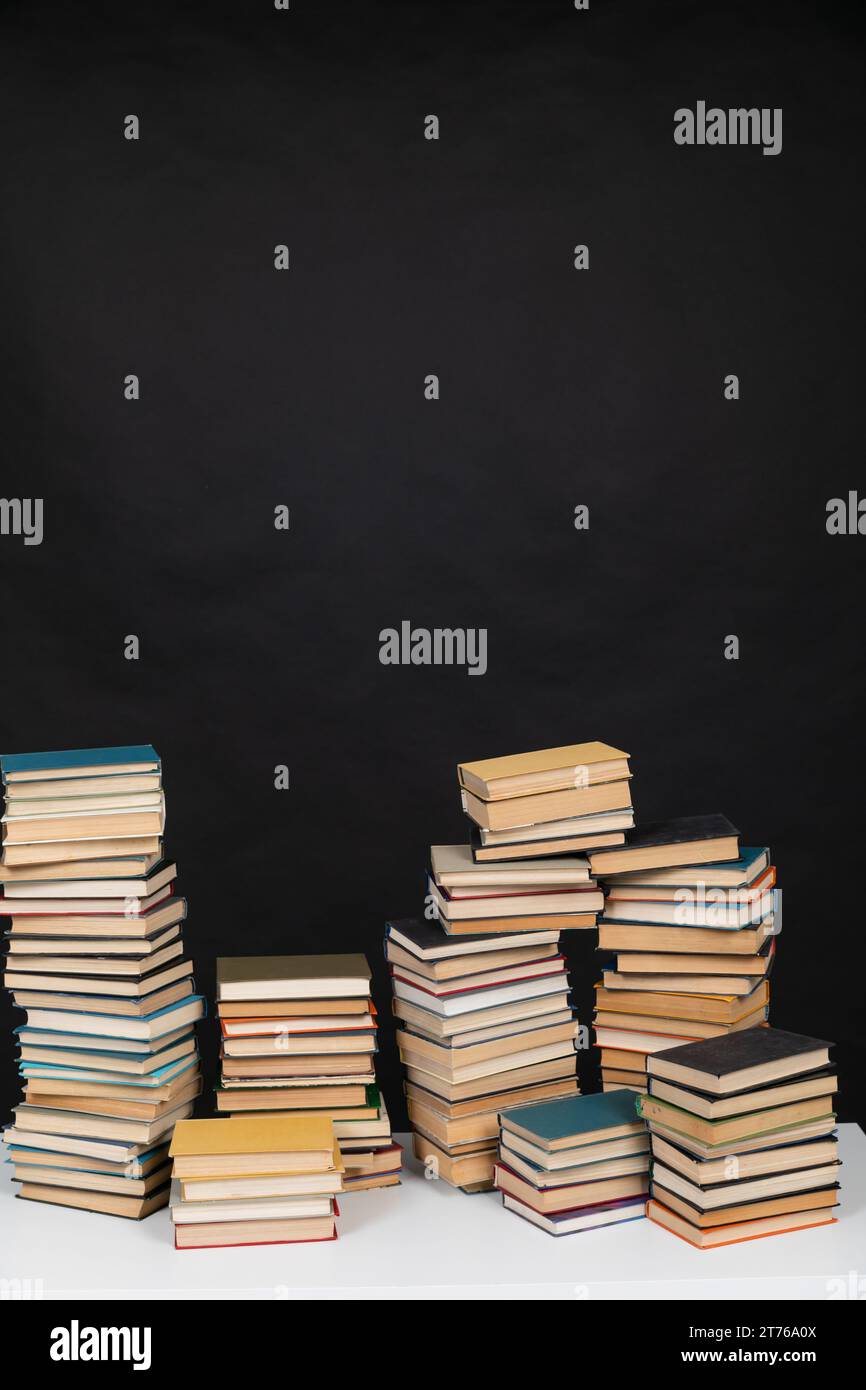 Stacks of books for learning in the school library Stock Photo - Alamy