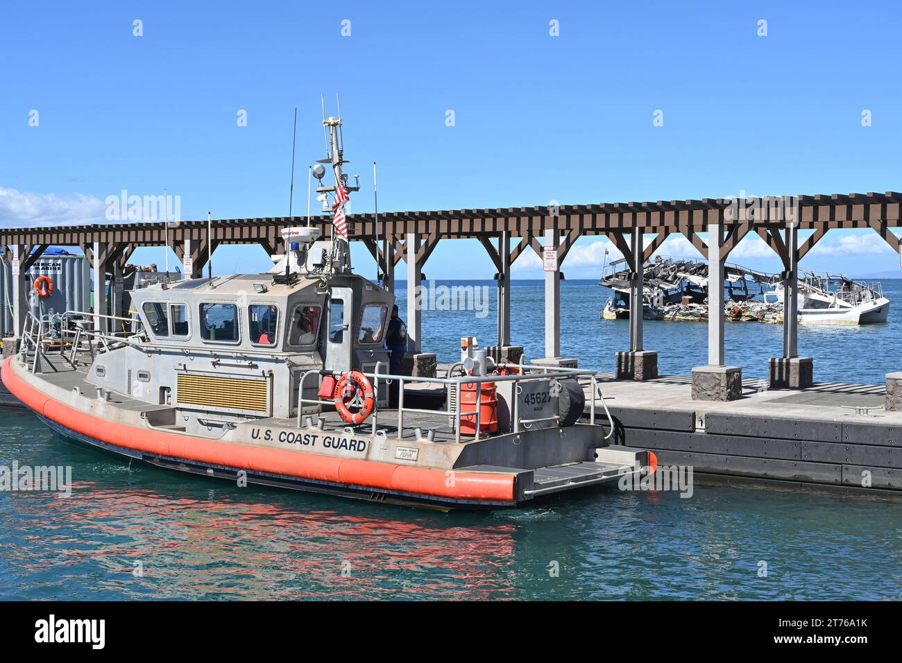 A Coast Guard Station Maui response boat-medium crew moors to a pier at ...