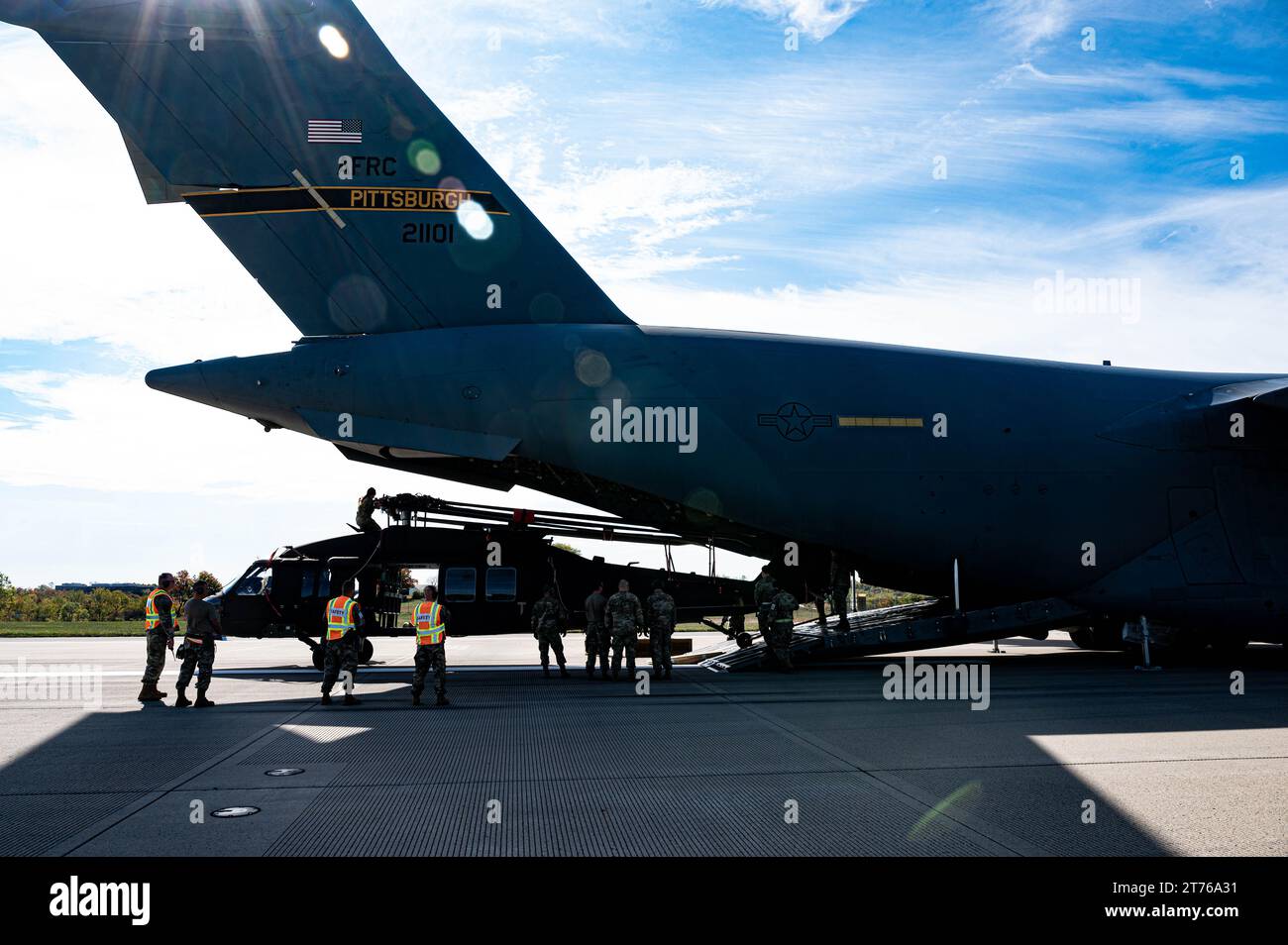 A Pennsylvania National Guard UH-60 Blackhawk helicopter is loaded into ...