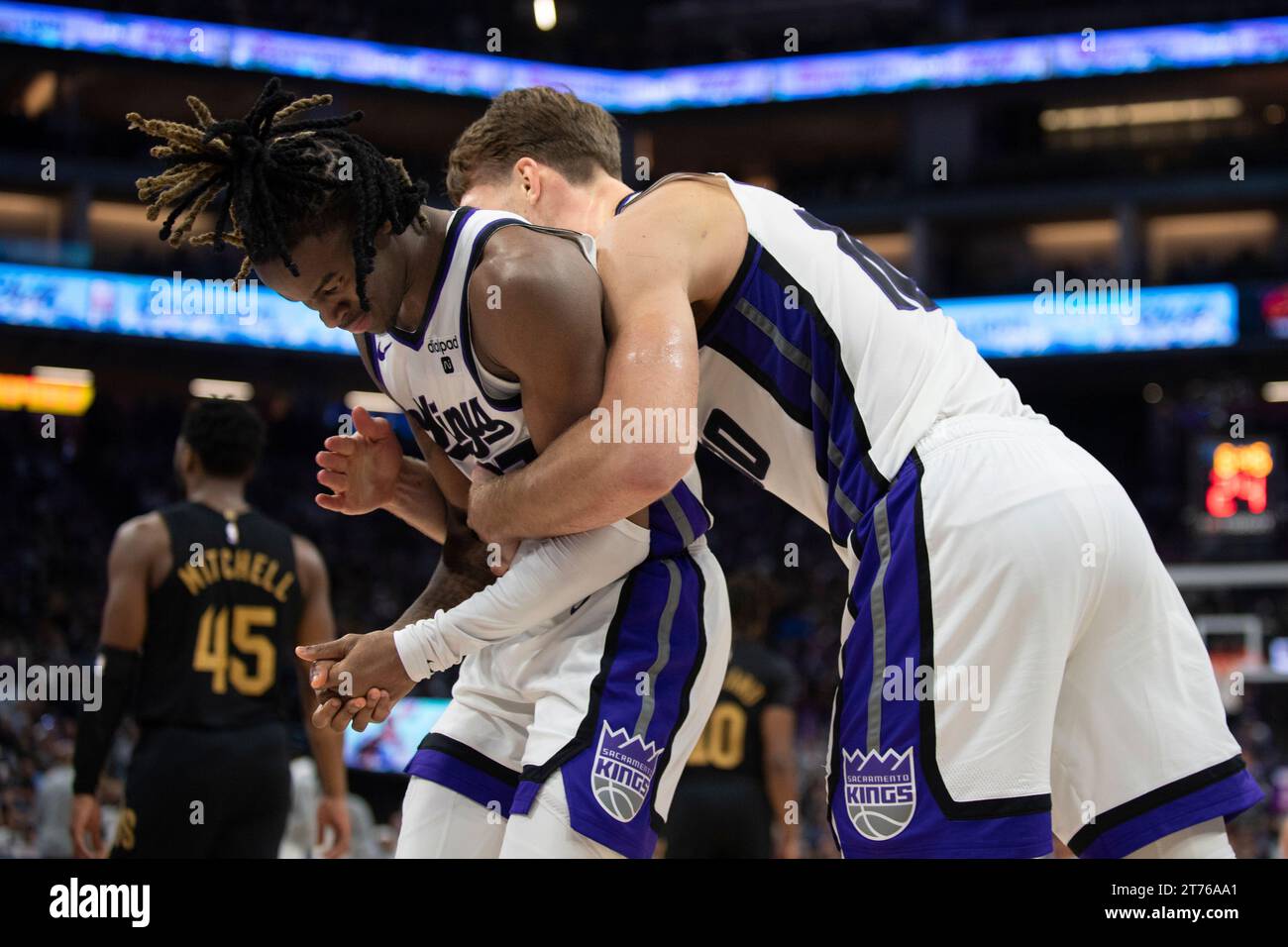 Sacramento Kings forward Domantas Sabonis, right, embraces guard Keon Ellis after scoring a ...