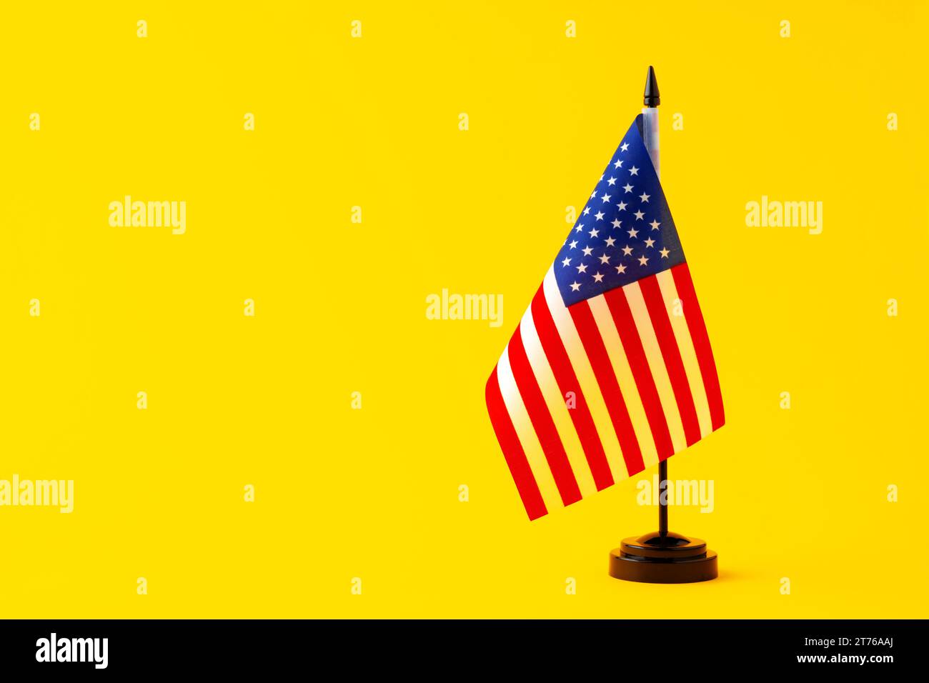 Small flag of USA on flagpole on studio background Stock Photo - Alamy