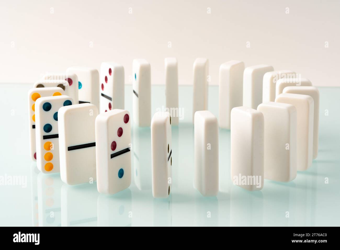 Domino tiles in a row on white background Stock Photo - Alamy