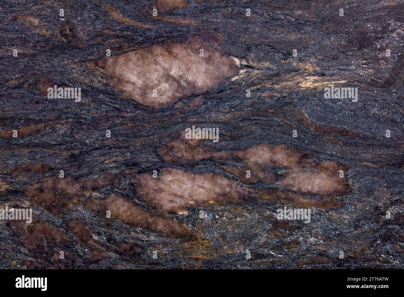 Unique texture of natural granite slab, with dark brown layers of rock ...