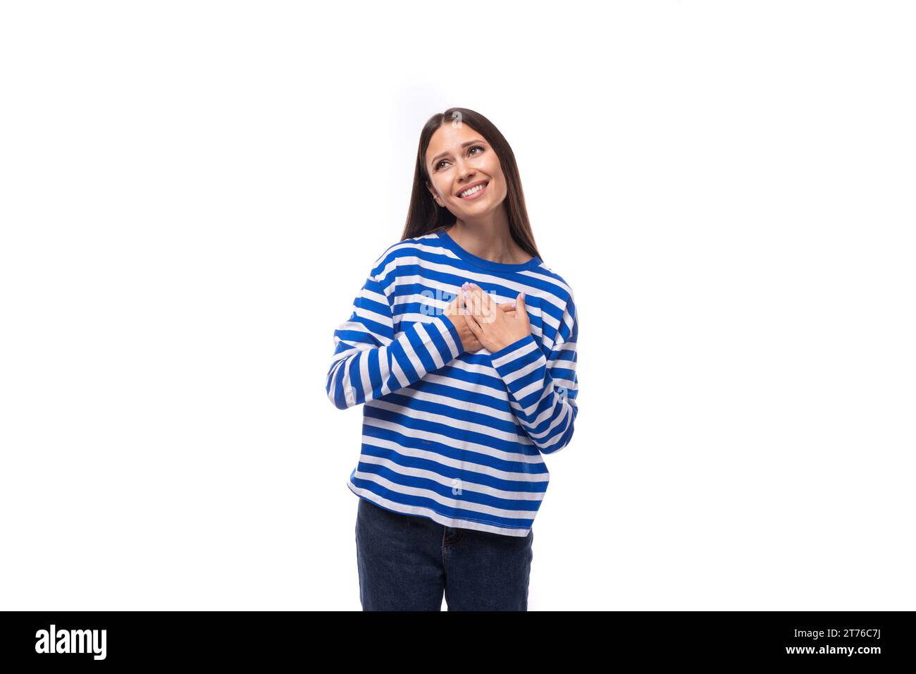 pretty young slim european model woman dressed in a blue sweater on a ...