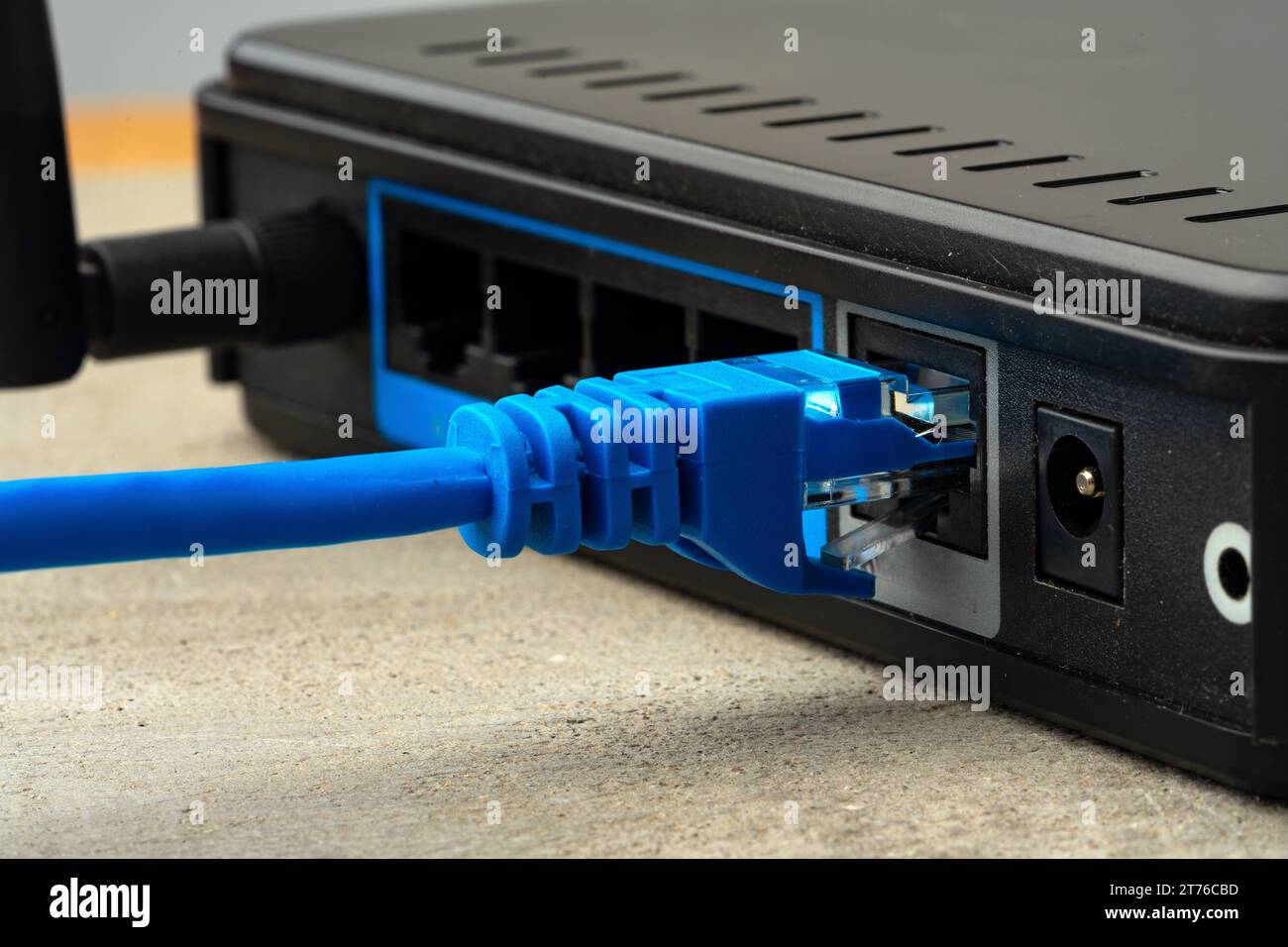 Modern router with cables plugged in close up Stock Photo - Alamy