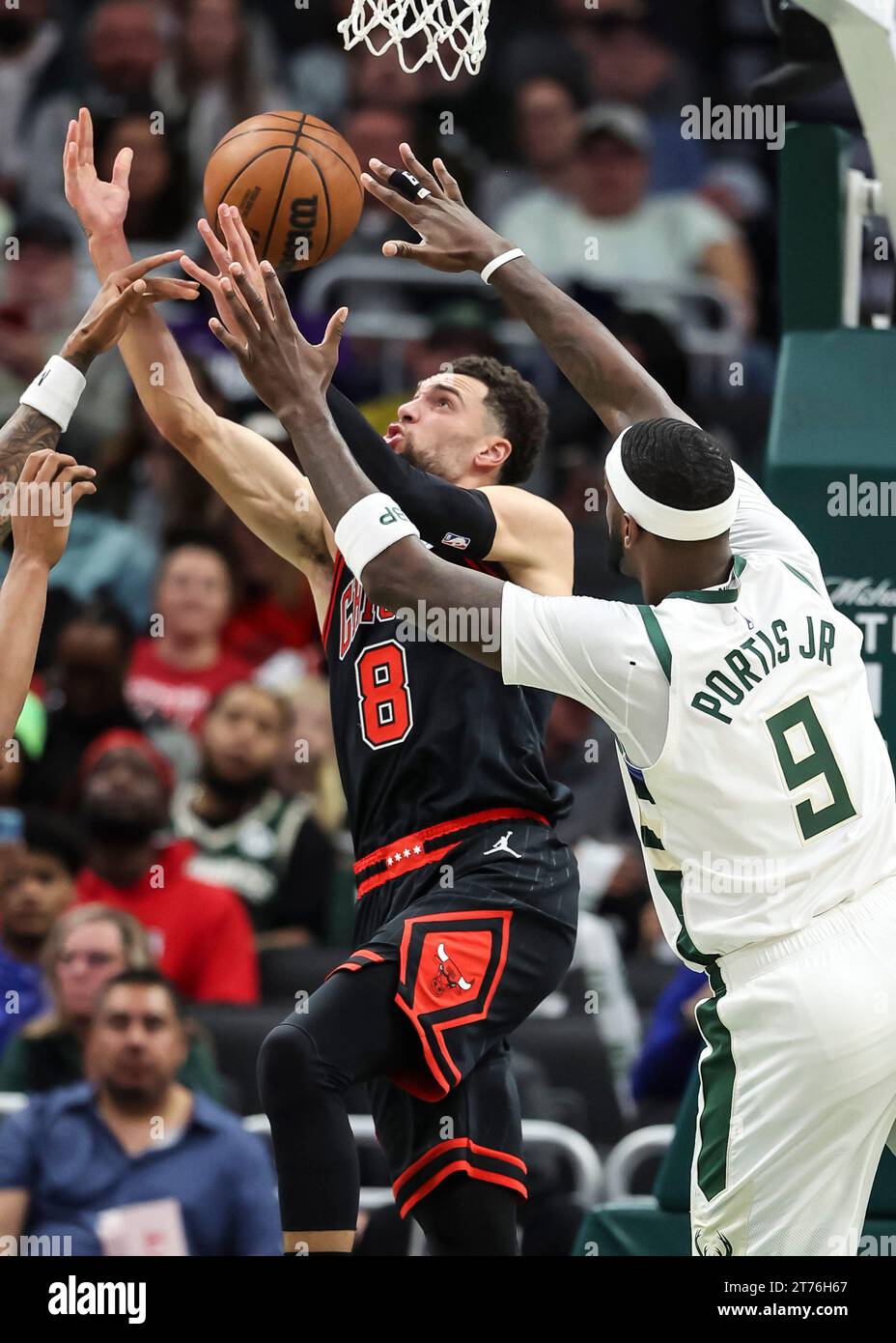 Milwaukee, USA. 13th Nov, 2023. Zach LaVine (L) of Chicago Bulls goes ...
