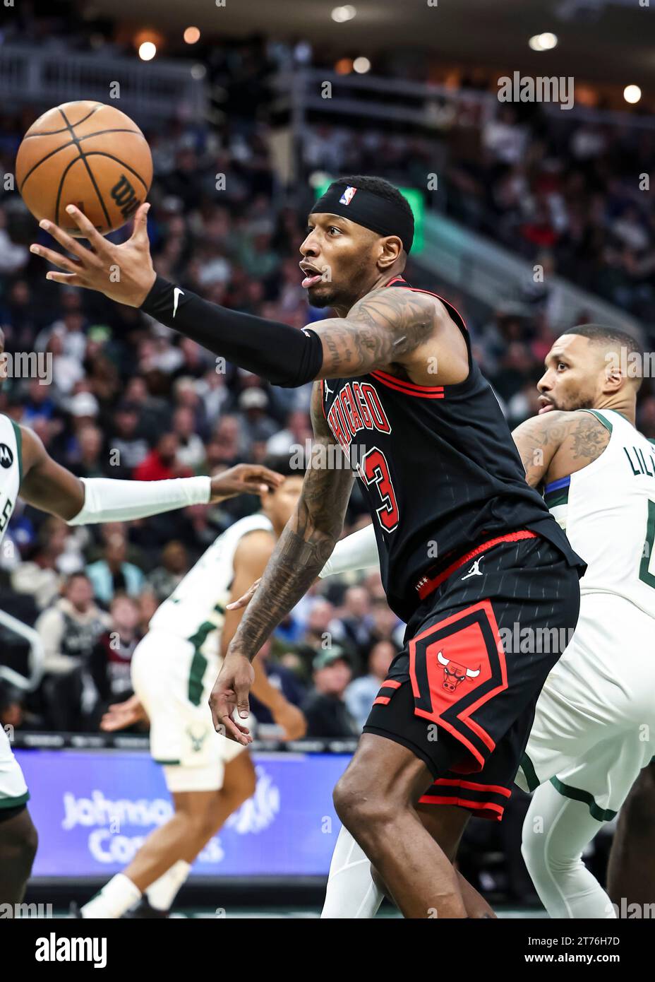 Milwaukee, USA. 13th Nov, 2023. Torrey Craig (front) of Chicago Bulls ...