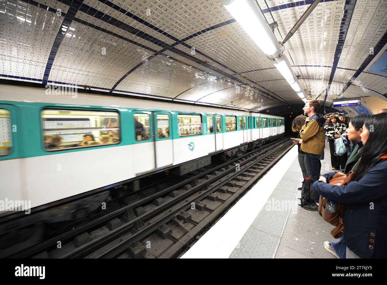 Passengers waiting for the Metro train at the Concorde Metro station in ...