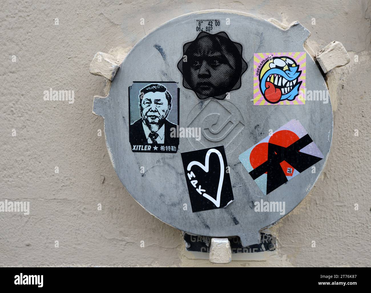 Political stickers on a wall in Paris, France Stock Photo - Alamy