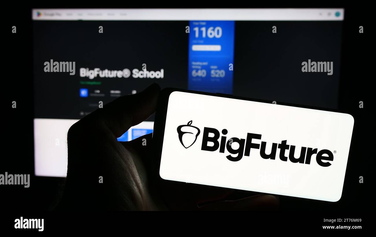 Person holding smartphone with logo of US educational online planning guide BigFuture in front ...