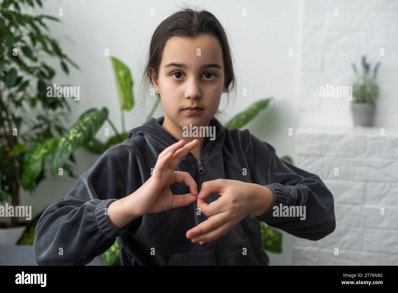 Beautiful smiling deaf girl using sign language Stock Photo - Alamy Beautiful smiling deaf girl using sign language Stock Photo - Alamy