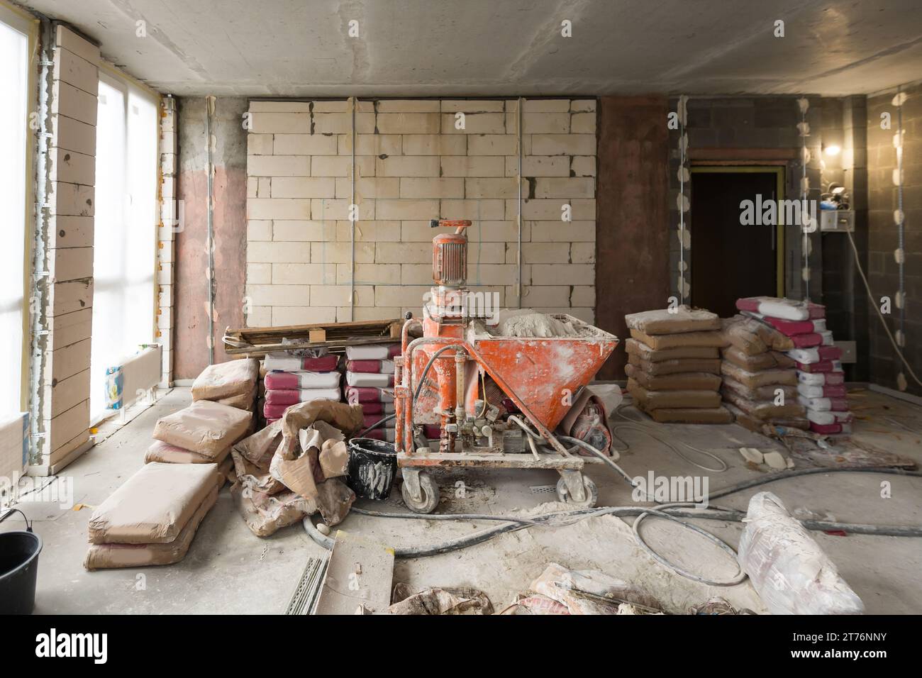 A specialized mixer for mixing dry plaster with water and automatically ...