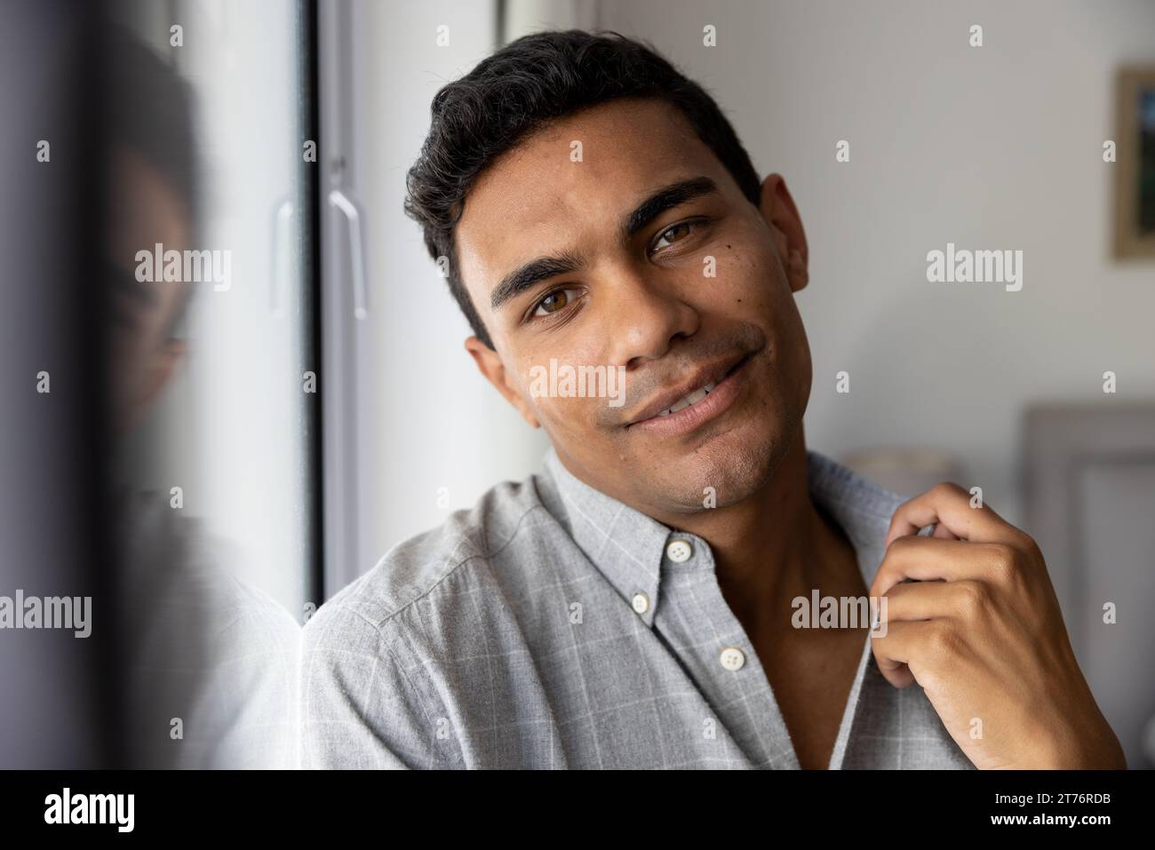 Man standing by the window hi-res stock photography and images - Alamy