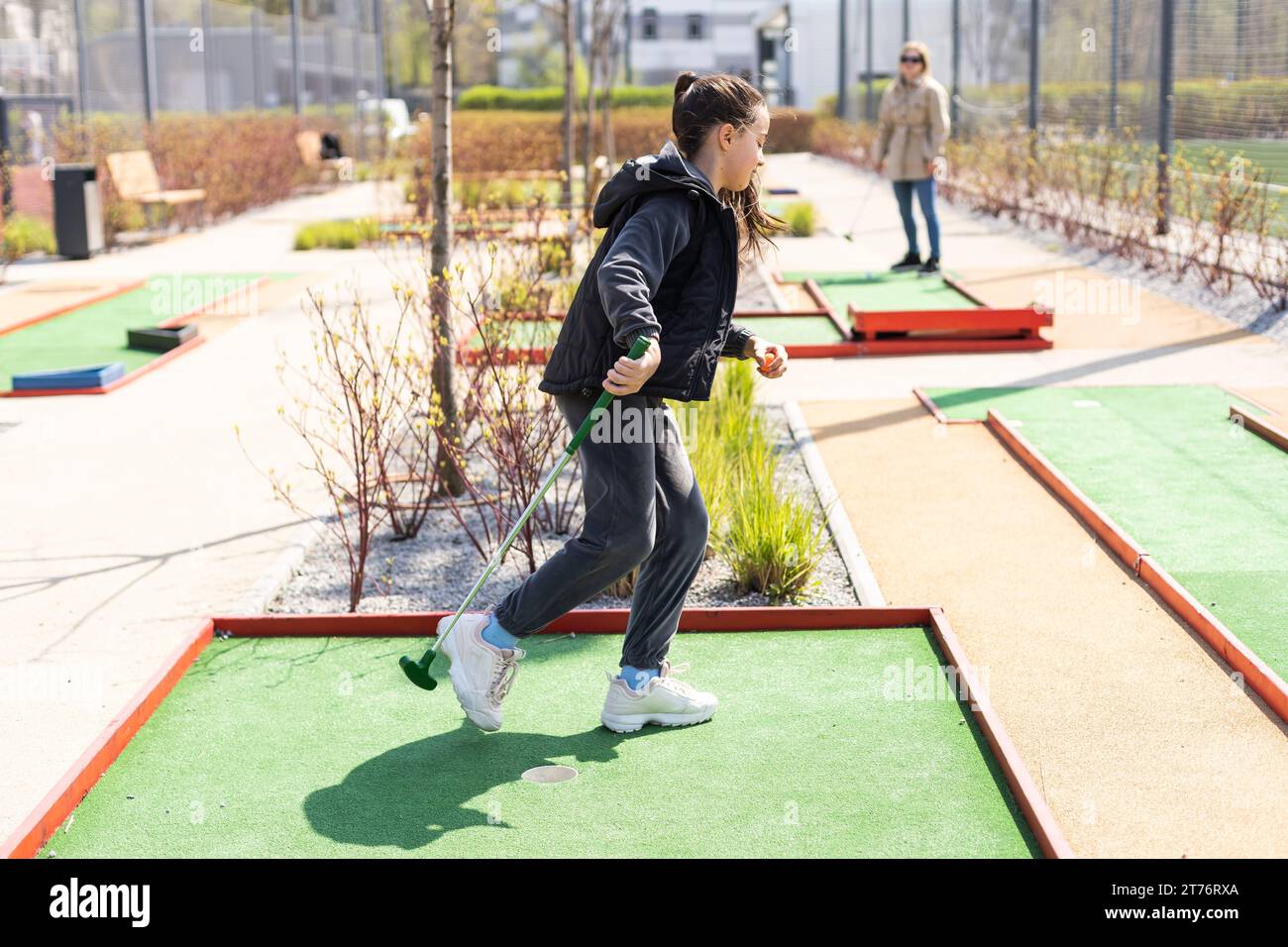 cute little girl on a miniature golf course Stock Photo - Alamy