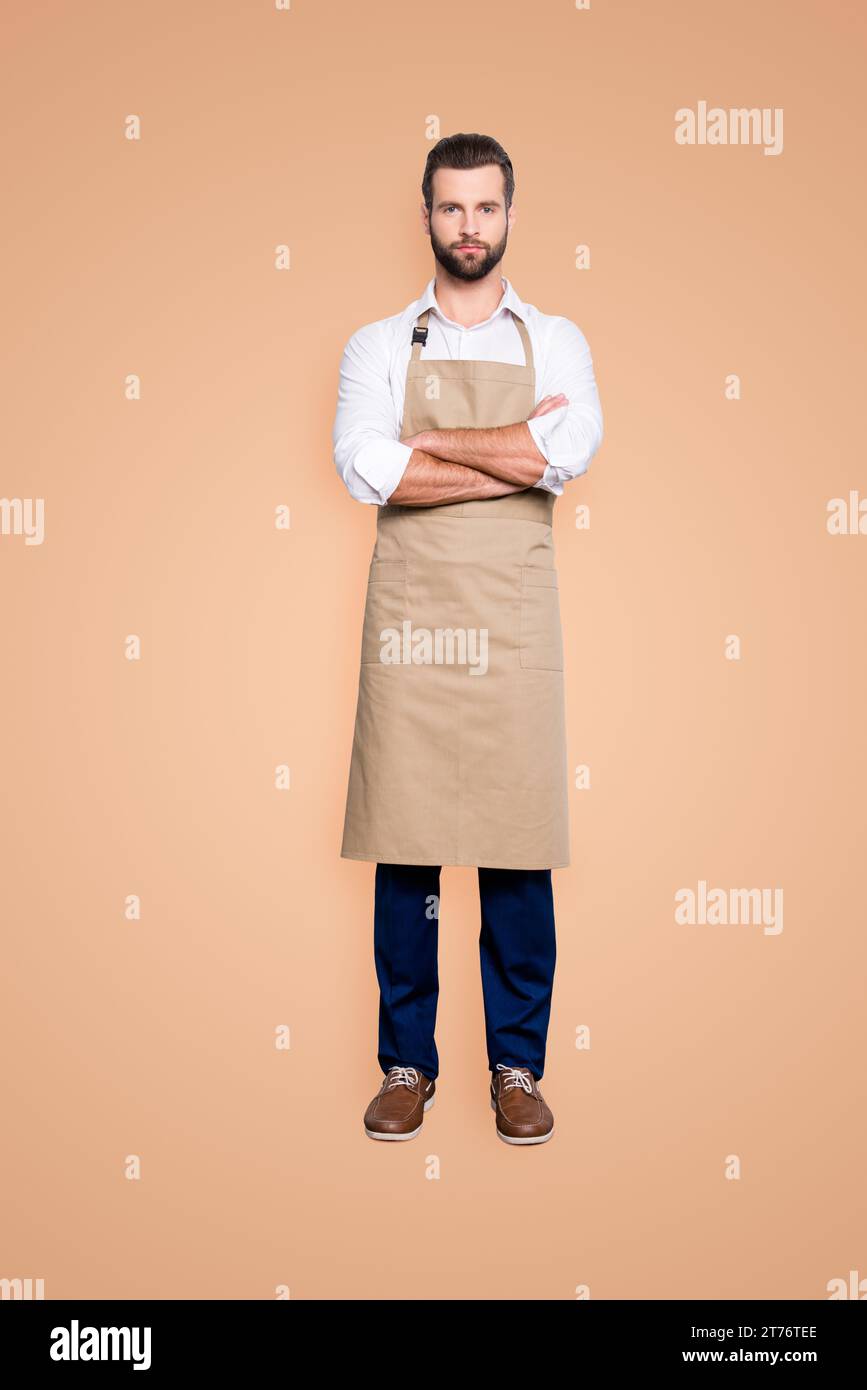Full size fullbody portrait of strict attractive barber in uniform ...
