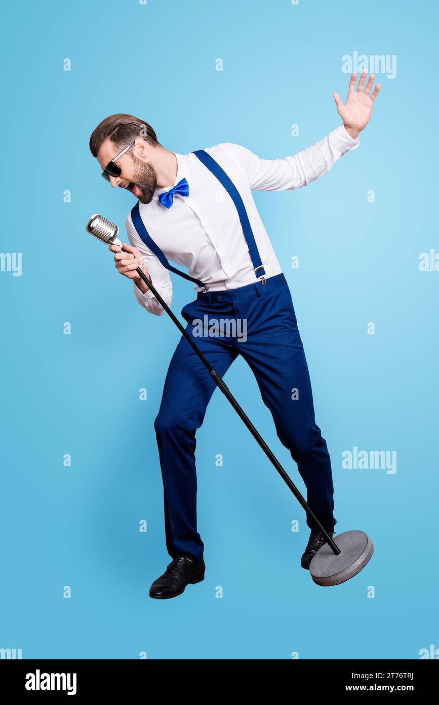 Full size fullbody portrait of famous creative singer in blue pants ...