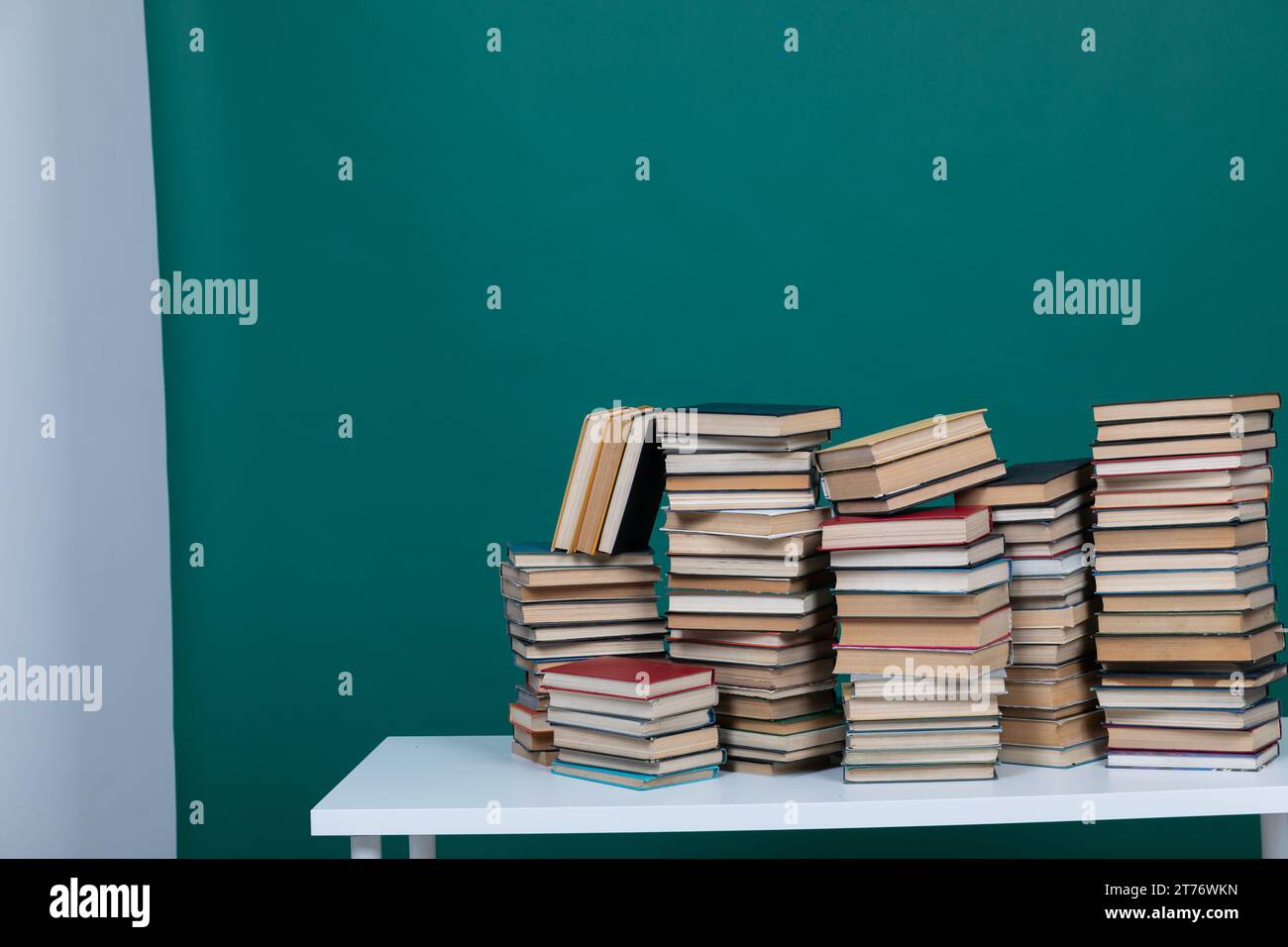 stack of books on a green background learning library learning science ...