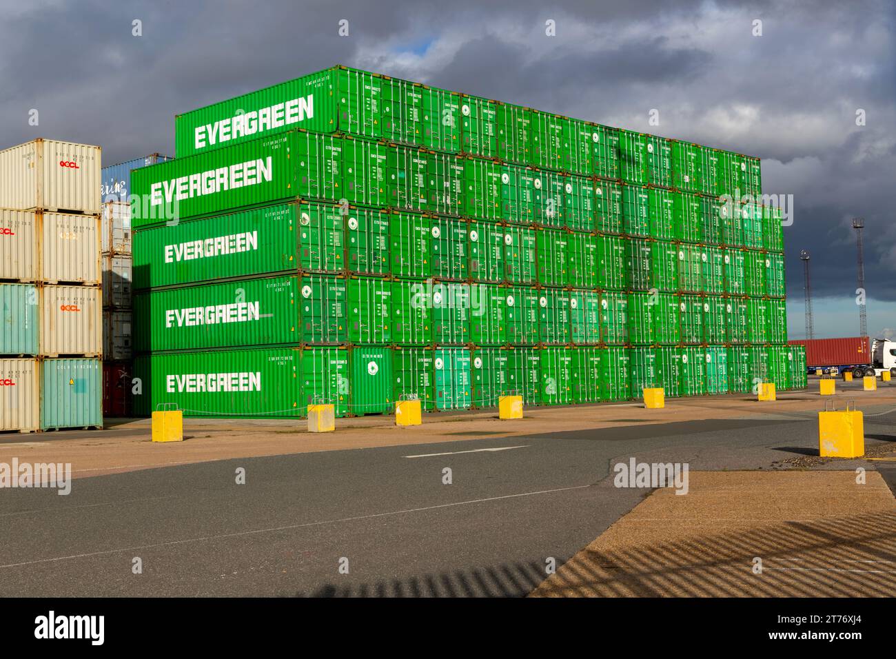Evergreen shipping containers stacked on quayside, Port of Felixstowe ...