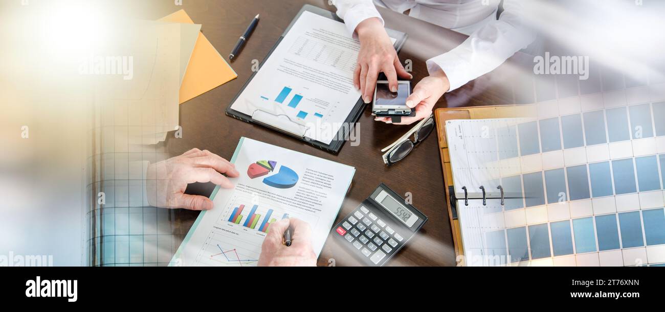 Two business people analyzing charts; multiple exposure Stock Photo - Alamy