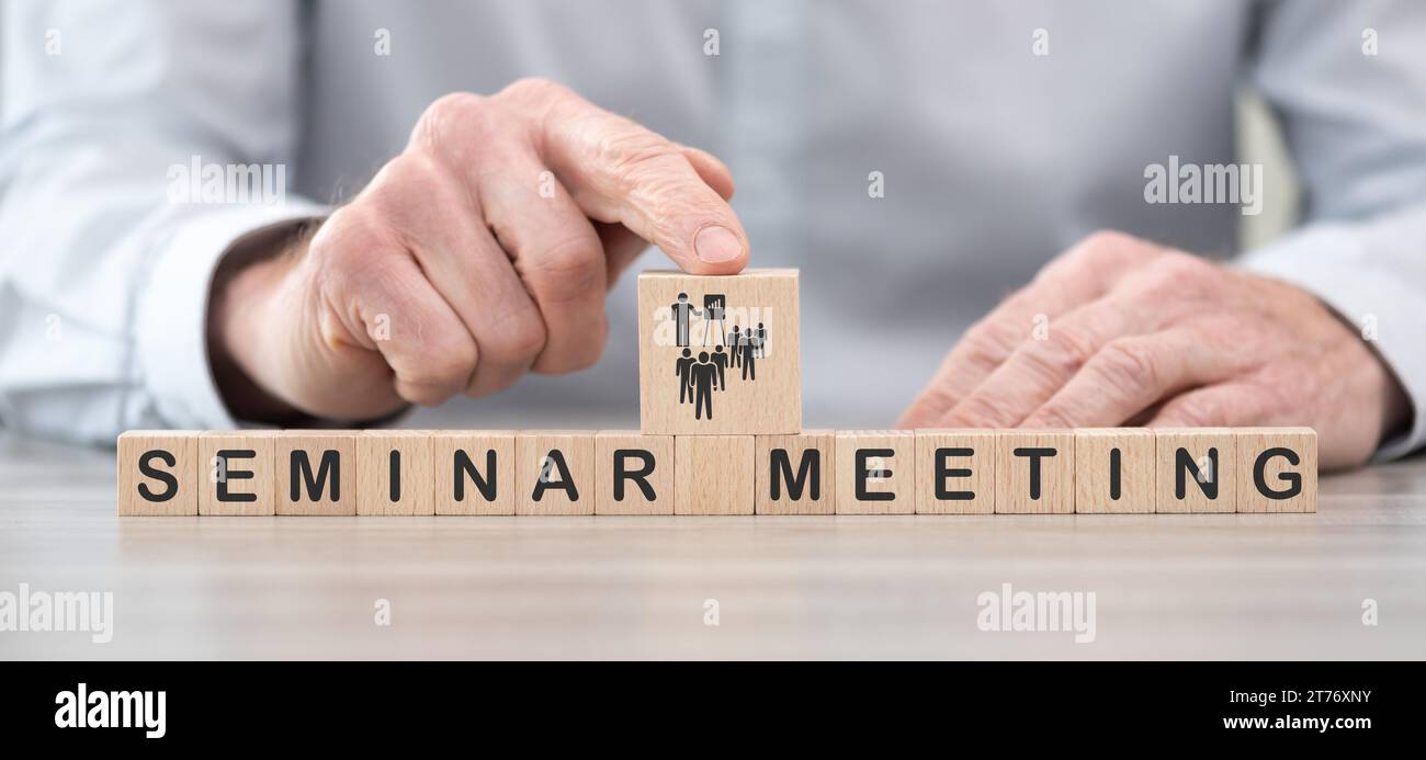 Wooden blocks with symbol of seminar meeting concept Stock Photo - Alamy
