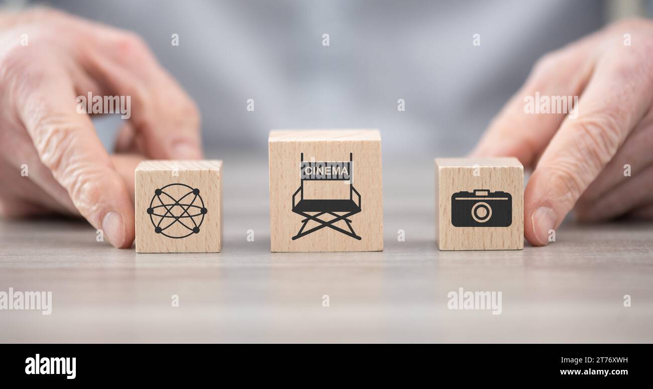 Wooden blocks with symbol of cinema concept Stock Photo - Alamy