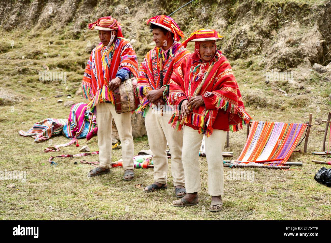 Men from the Ccaccaccollo Community in traditional dress playing ...