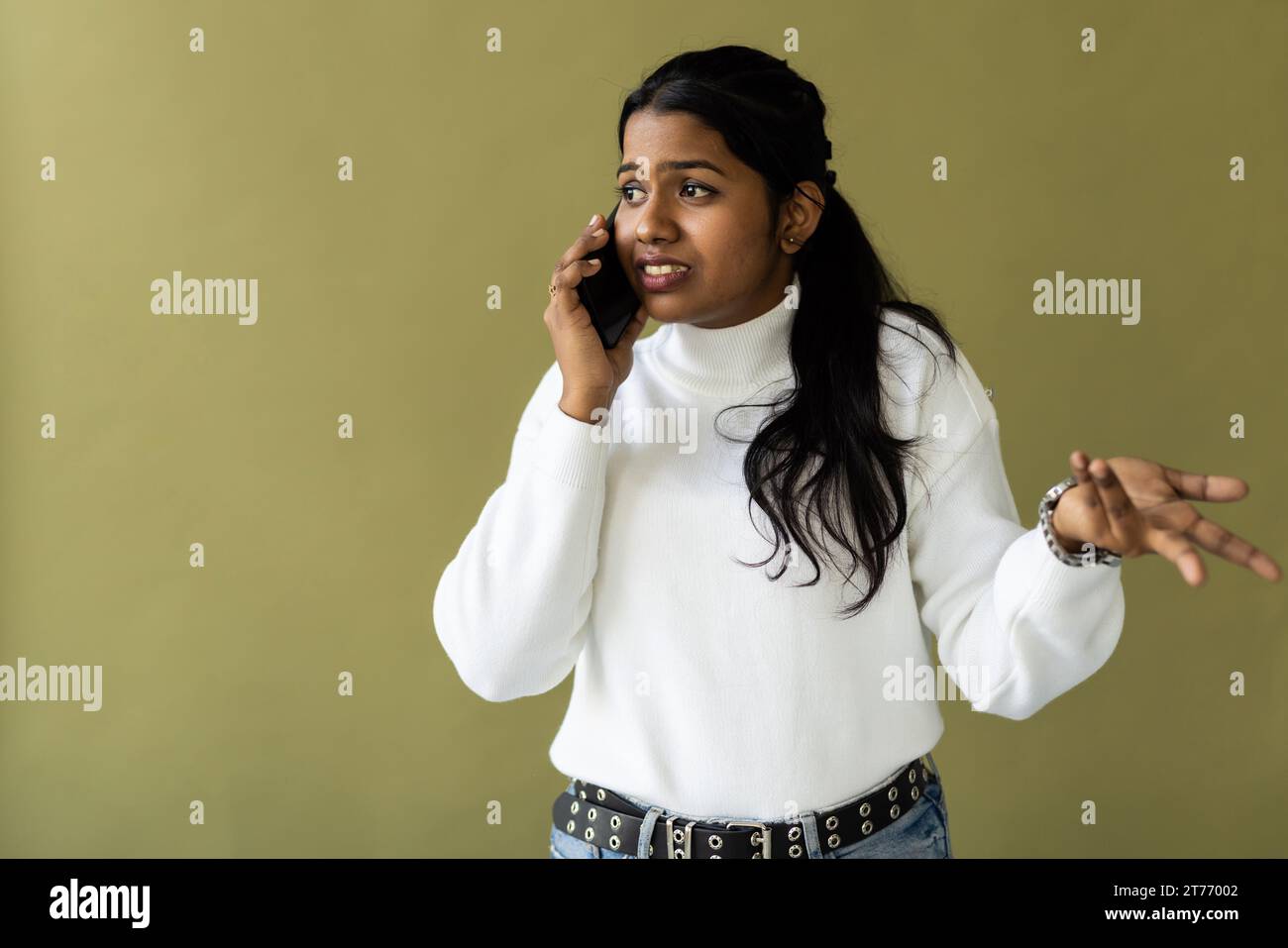 Indian woman talking on cellphone Stock Photo - Alamy
