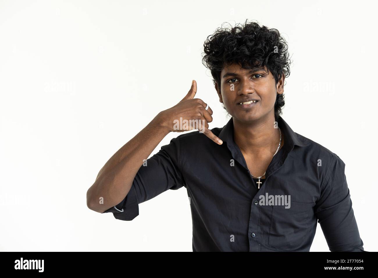 Indian young man doing phone gesture like says call me back isolated on ...