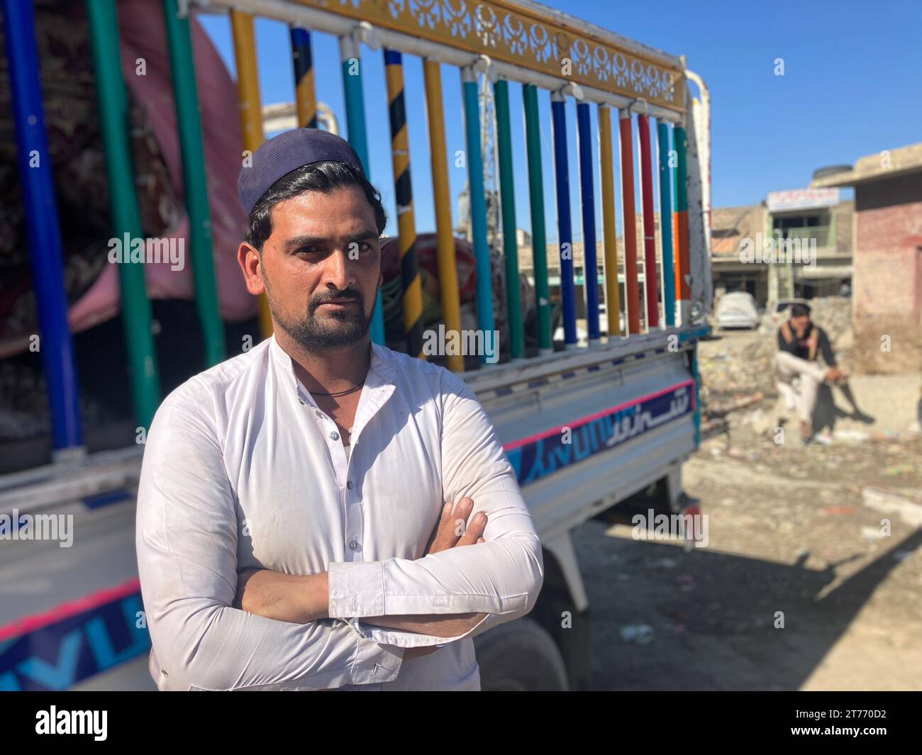 Torcham, Pakistan. 10th Nov, 2023. Ismail Khan stands with his family ...