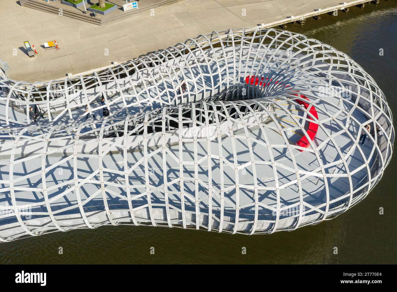 Aerial view winding modern foot bridge made of steel webbing at ...