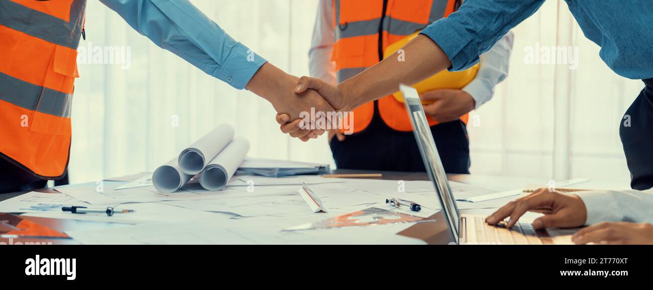 Construction engineer handshake with businessman contractor over ...