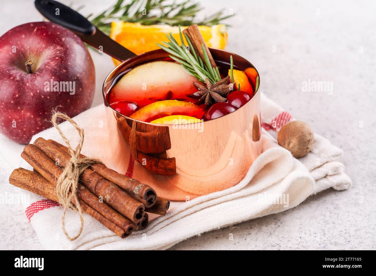Hot mulled wine with fruits and spices in a copper pot Stock Photo - Alamy