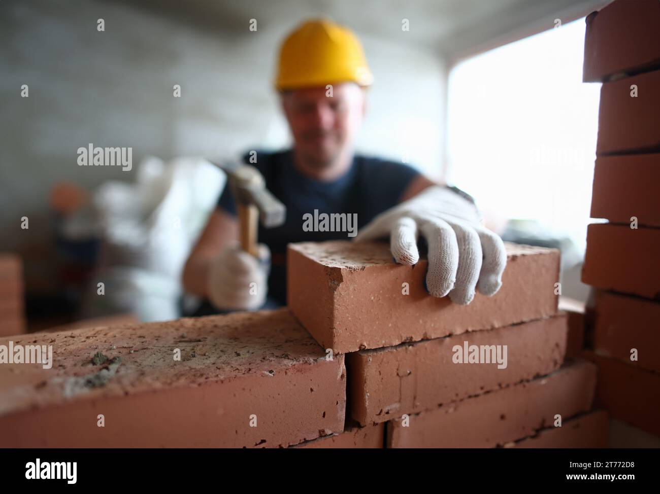 Professional bricklayer working on construction Stock Photo - Alamy