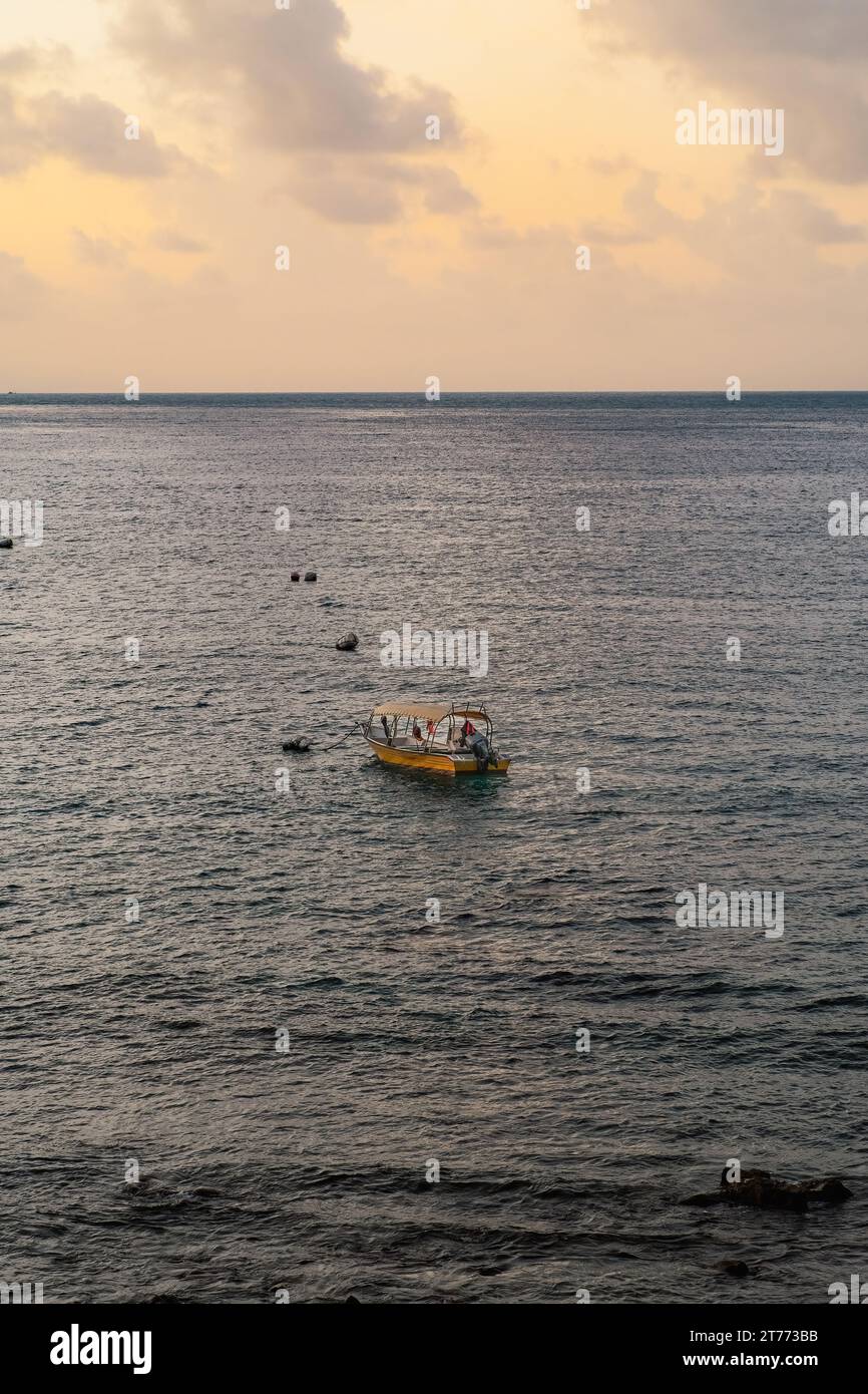 An empty boat floating during sunrise in Perhentian Island, Terengganu ...