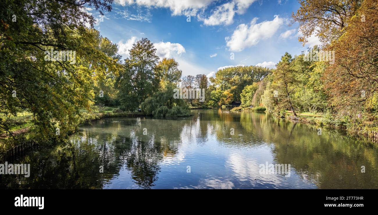 Landscape with reflection of trees and sky in the water Stock Photo - Alamy