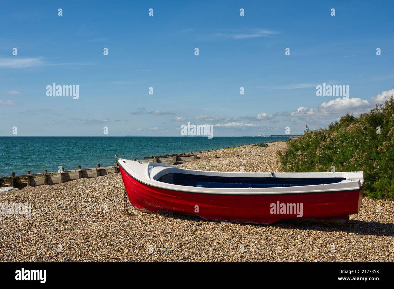 Shingle beach with boat at East Preston near Littlehampton in West ...