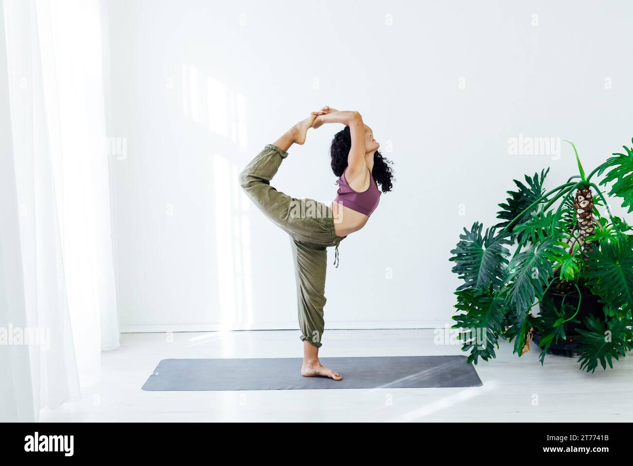 leg exercises stretching yoga classes in the gym Stock Photo - Alamy