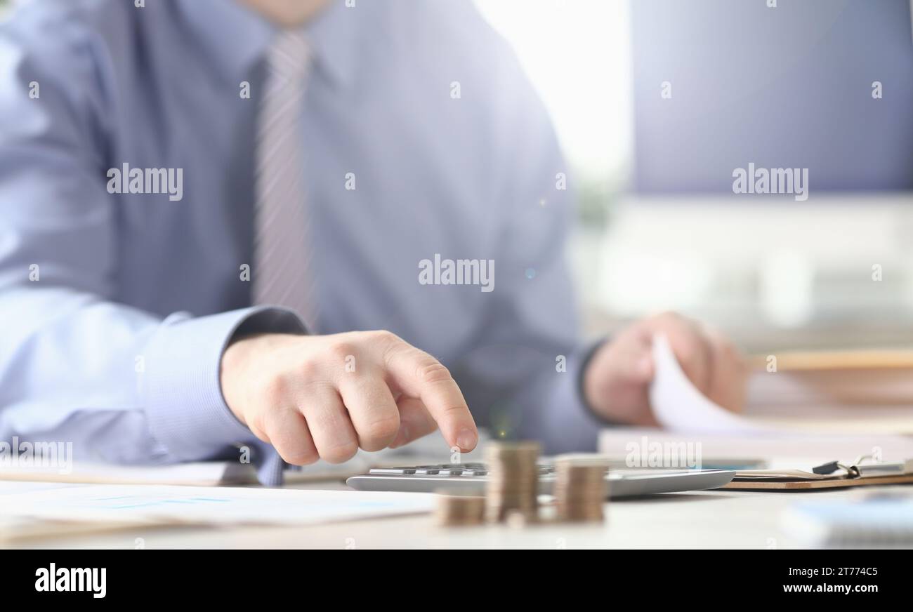 Bookkeeper calculate expenses tax hi-res stock photography and images ...